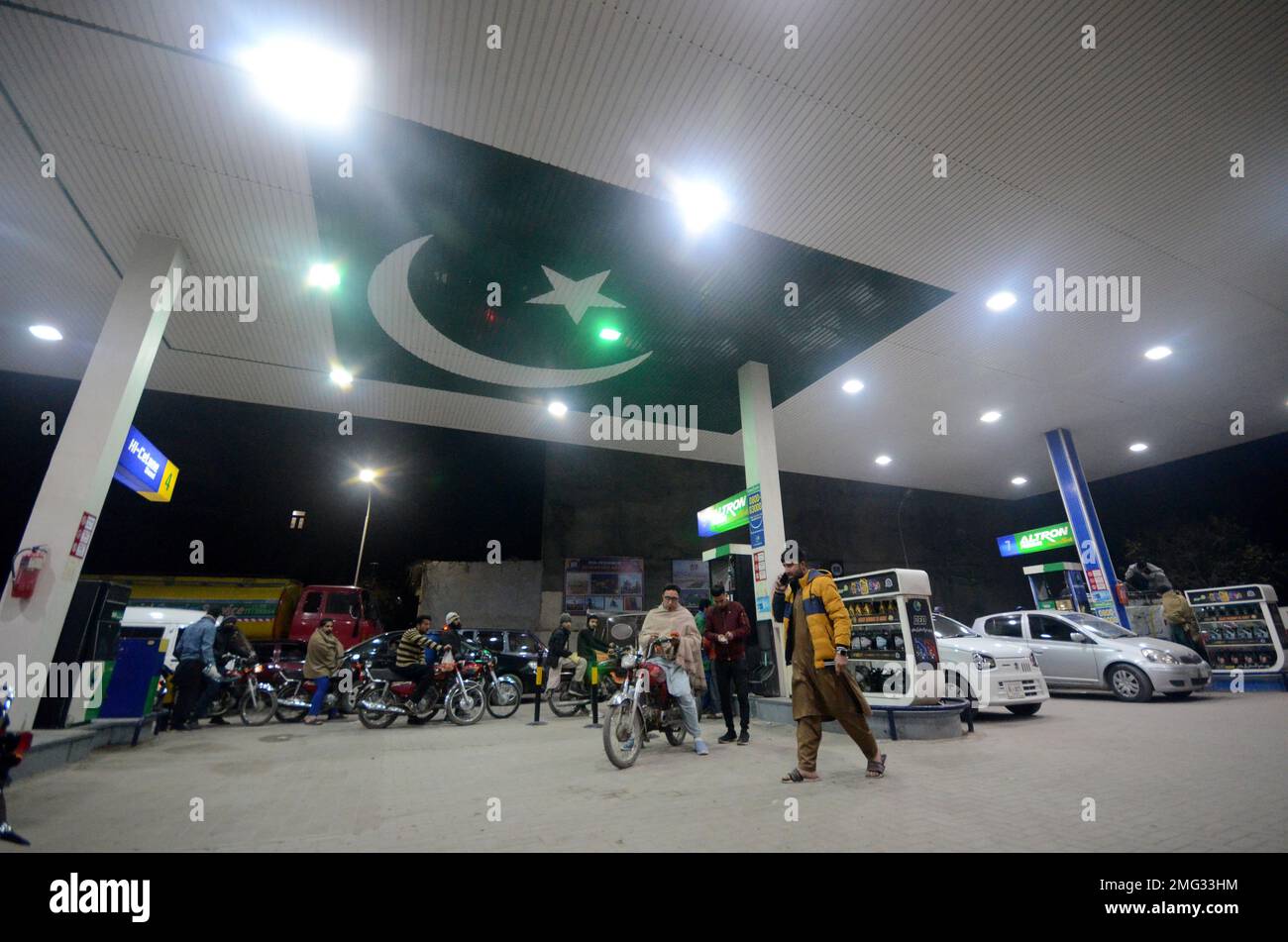 People wait for their turn to get fuel at a petrol station, a day after a country-wide power ...