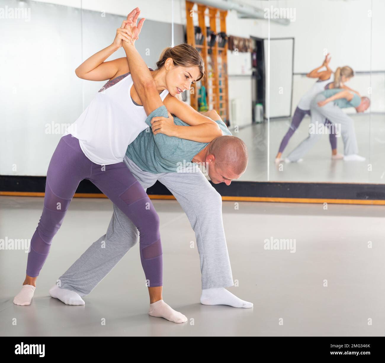 Woman practicing basic self defense skills in gym Stock Photo - Alamy
