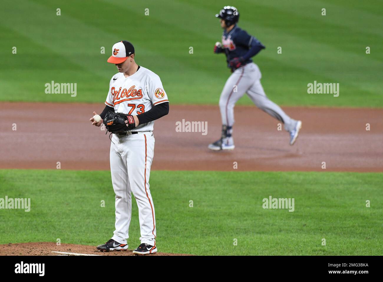 Baltimore Orioles starting pitcher Tom Eshelman (73) reacts to home run ...