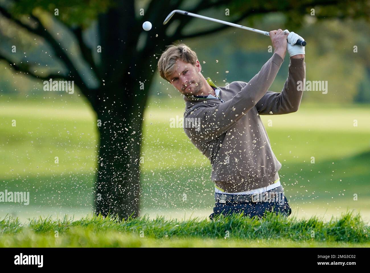 Thomas Detry, of Belgium, hits out of a bunker on the 11th hole during ...