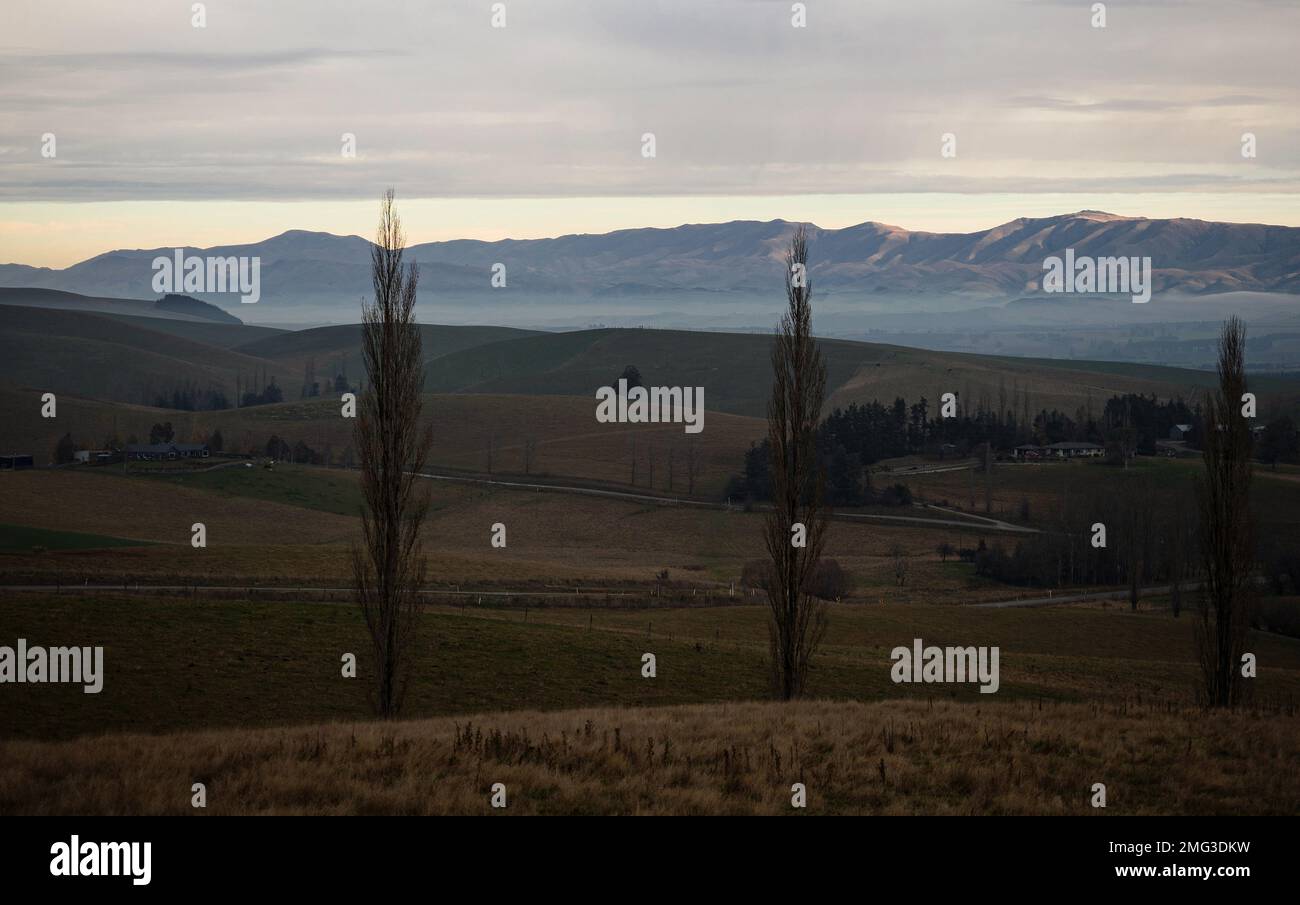 Panorama view of mountain range with low hanging clouds along Highway ...