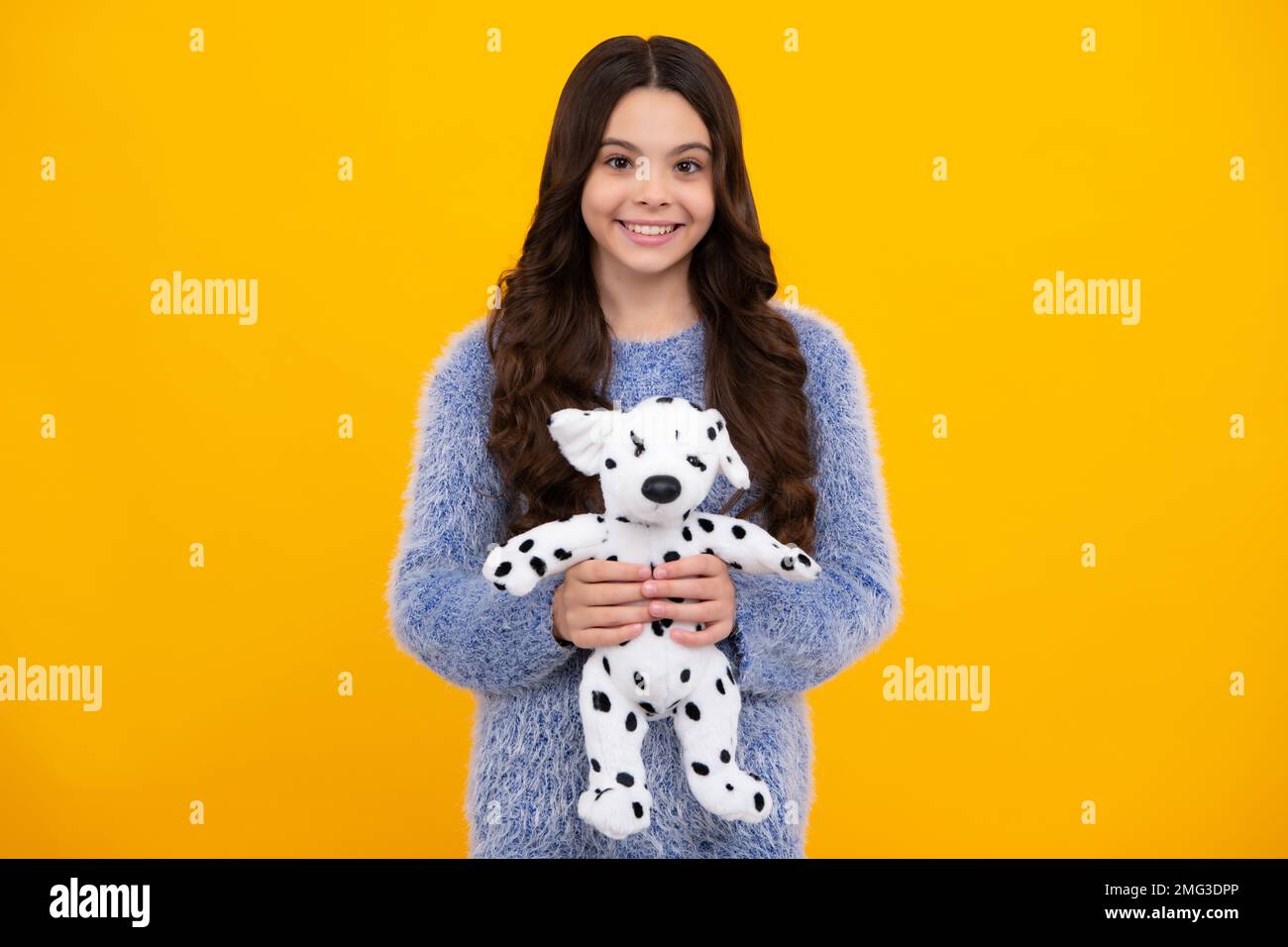 Childhood, toys and kids. Cute teen girl cuddling fluffy toy. Happy ...