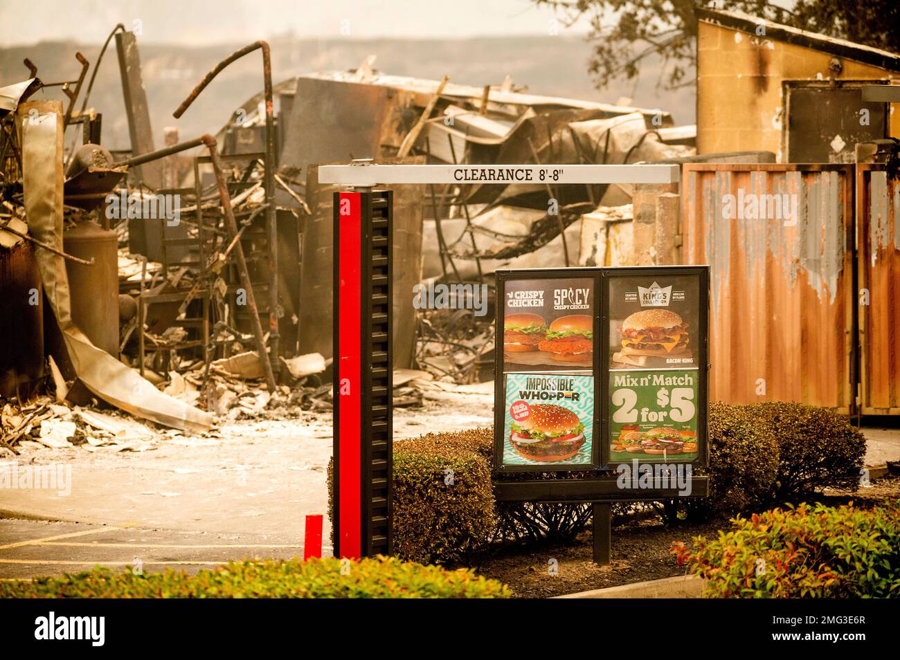 A drive-thru menu stands at a Burger King destroyed by the Almeda Fire ...
