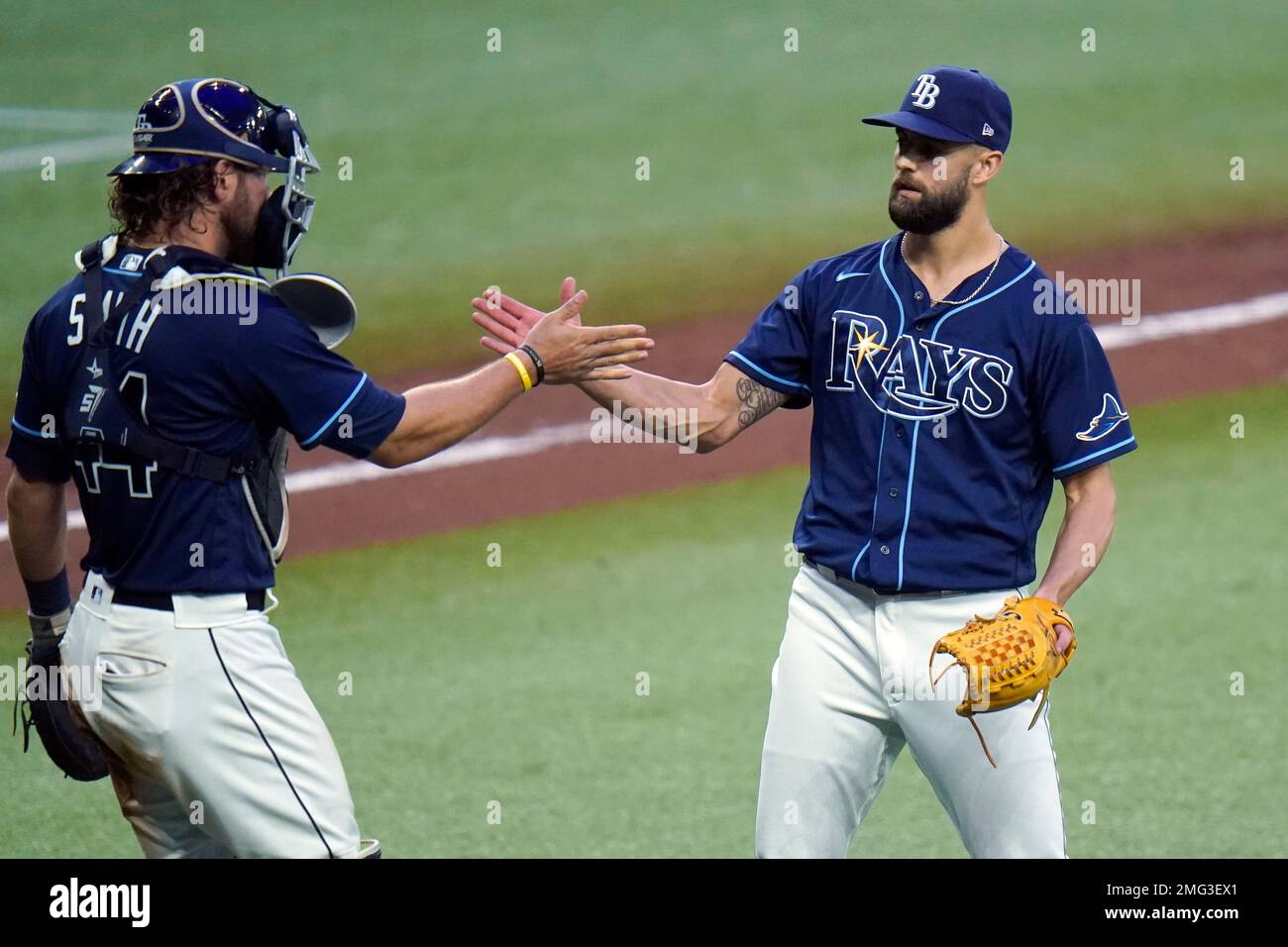 Tampa Bay Rays relief pitcher Nick Anderson celebrates with catcher ...