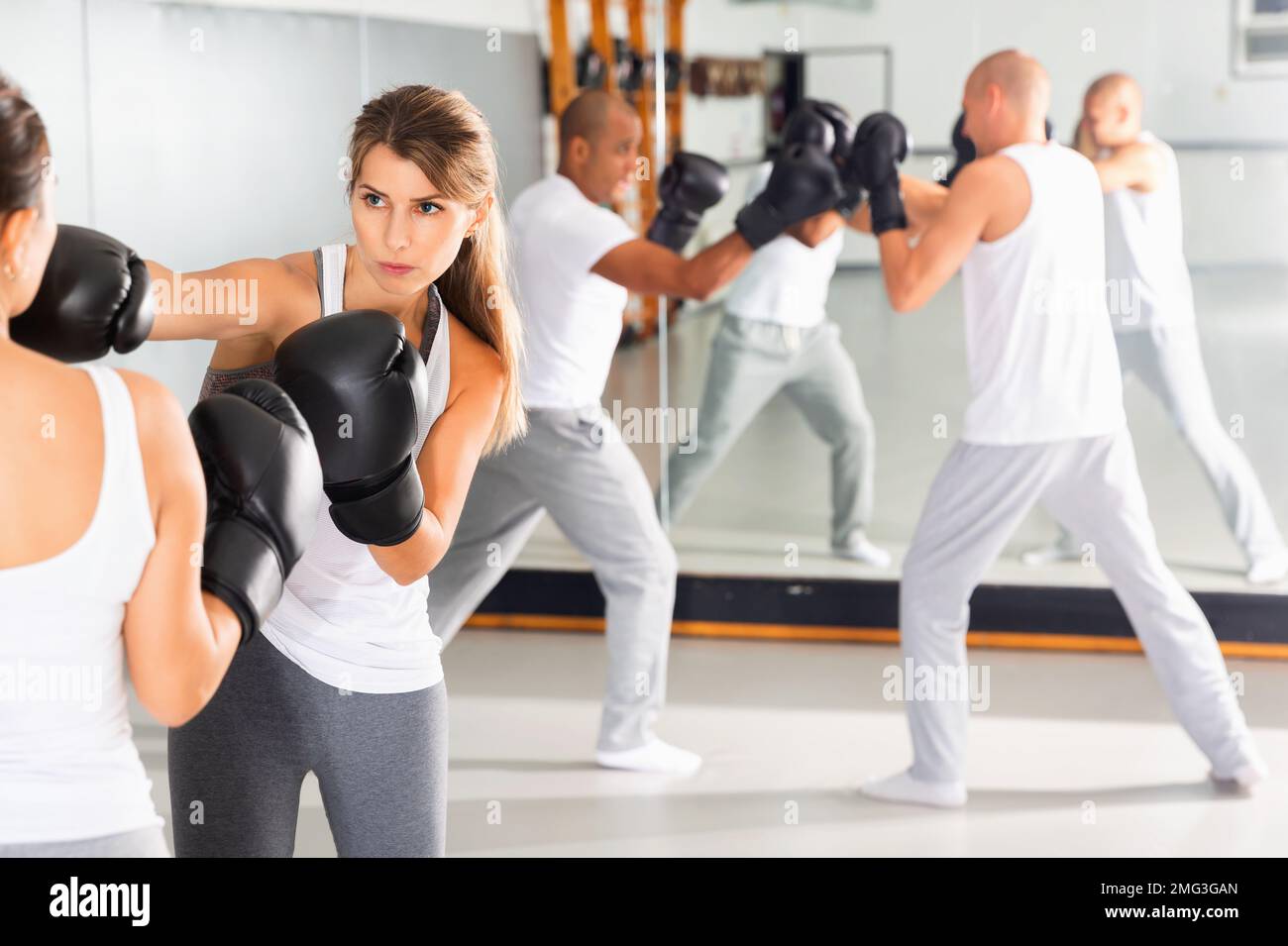 Two women boxing sparring in the gym Stock Photo - Alamy