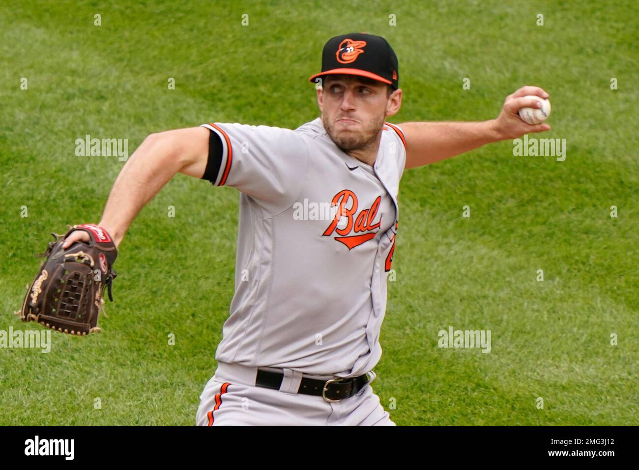 Baltimore Orioles starting pitcher John Means winds up in a baseball ...