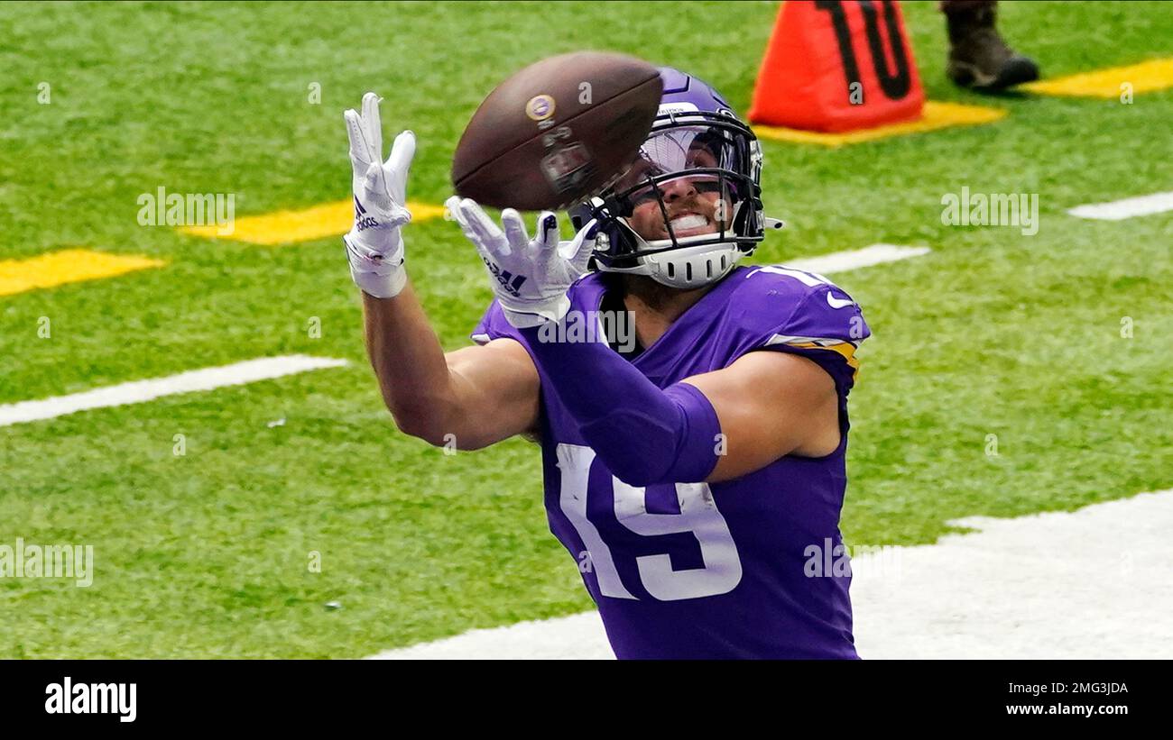 Minnesota Vikings wide receiver Adam Thielen (19) reaches for a pass ...