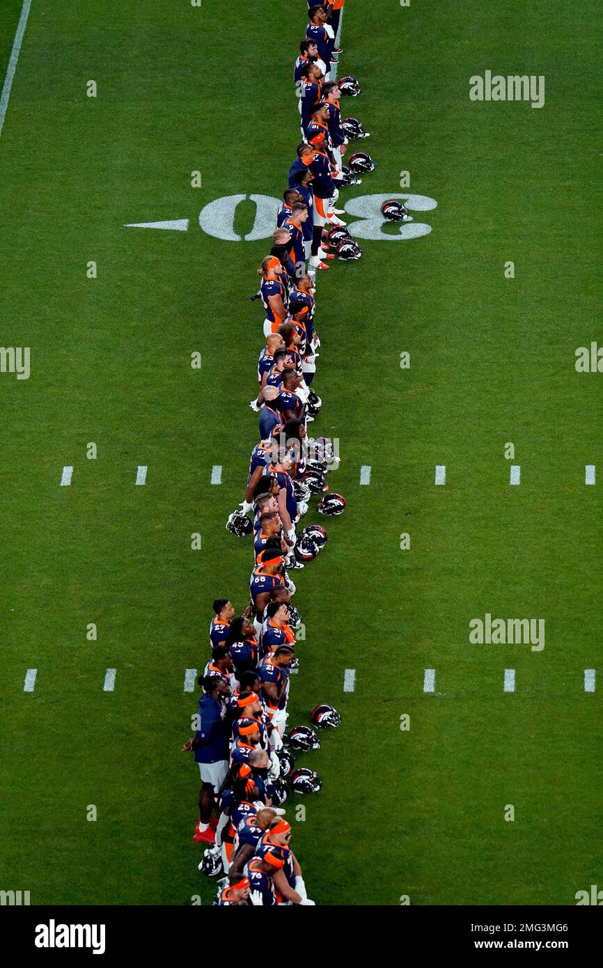 The Denver Broncos stand during a rendition of "Lift Every Voice and ...
