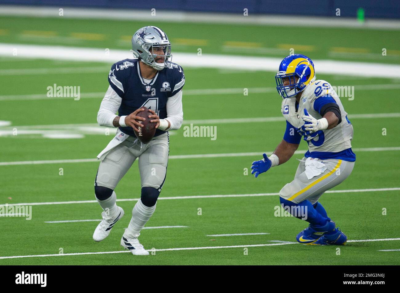 Los Angeles Rams defensive end Aaron Donald, right, chases Dallas ...