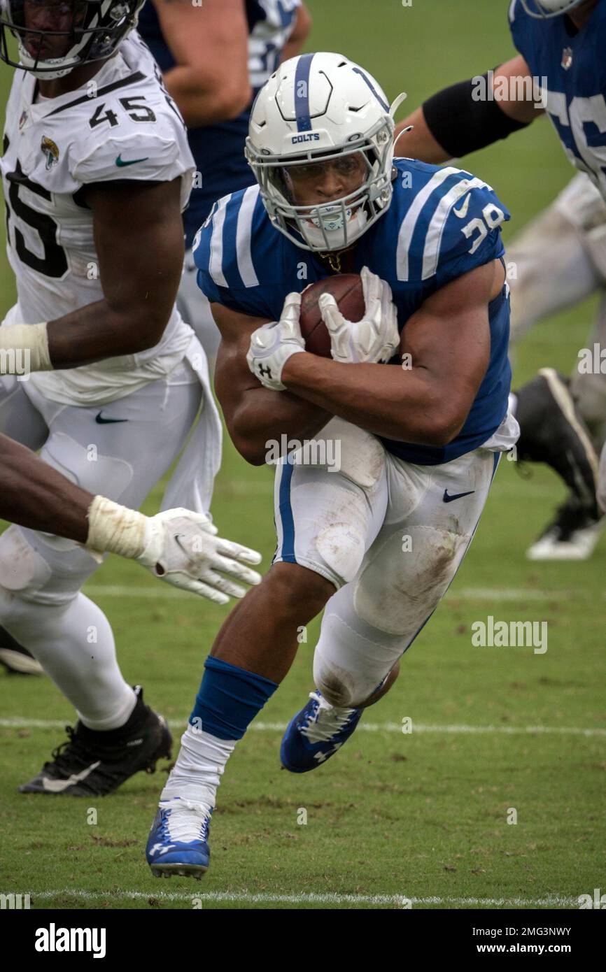 Indianapolis Colts running back Jonathan Taylor (28) runs through a ...