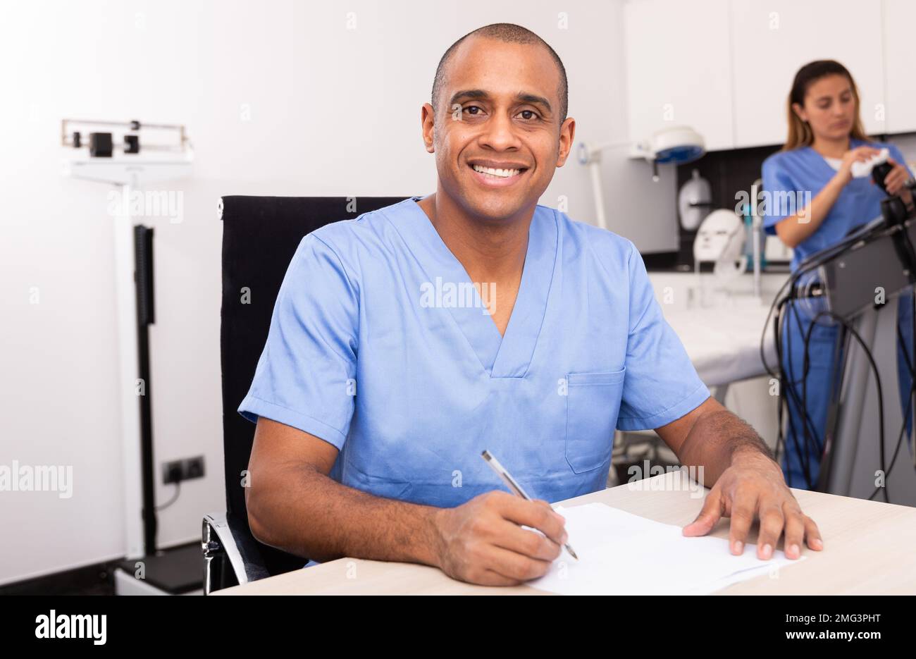 Doctor cosmetologist filling medical form in cosmetology office Stock ...