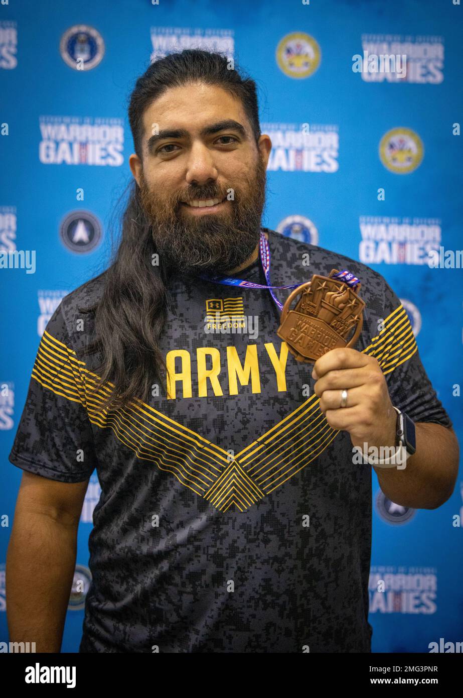 Retired U.S. Army Staff Sgt. Justin Mathers poses after earning his ...