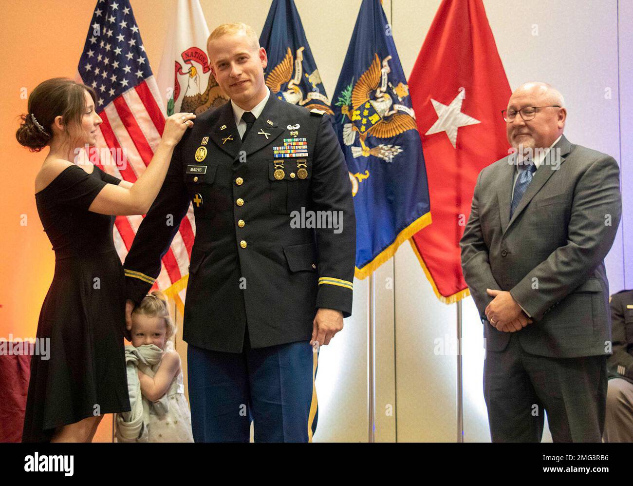 2nd Lt. Adam Mathis of Altamont, Illinois, has his new rank pinned on ...