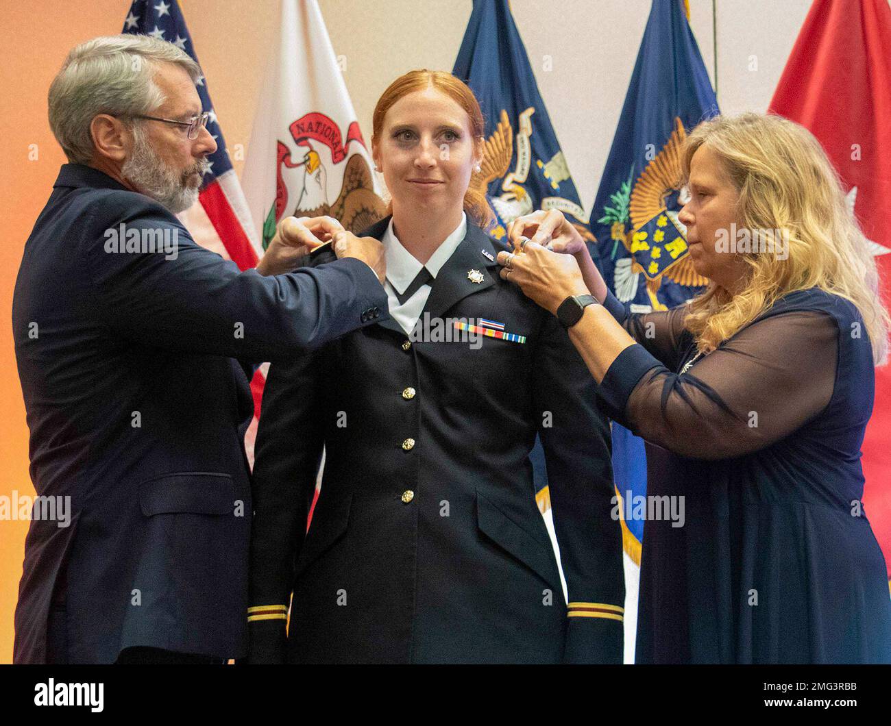 2nd Lt. Danielle Berny of Chicago has her new rank pinned on by her ...