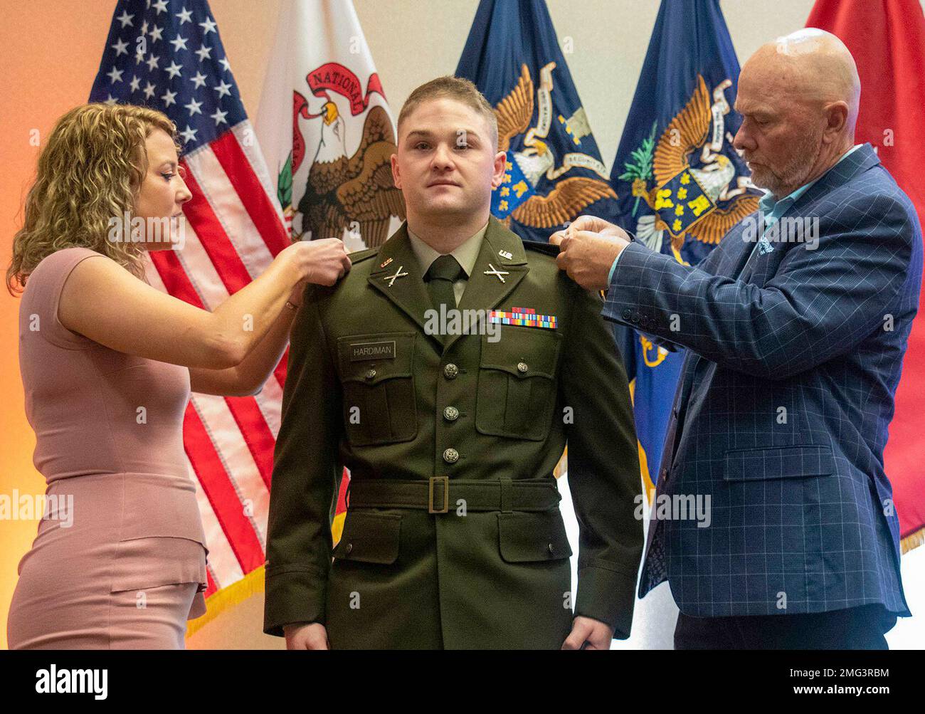 2nd Lt. Kyle Hardiman of Alsip, Illinois, has his new rank pinned on by ...