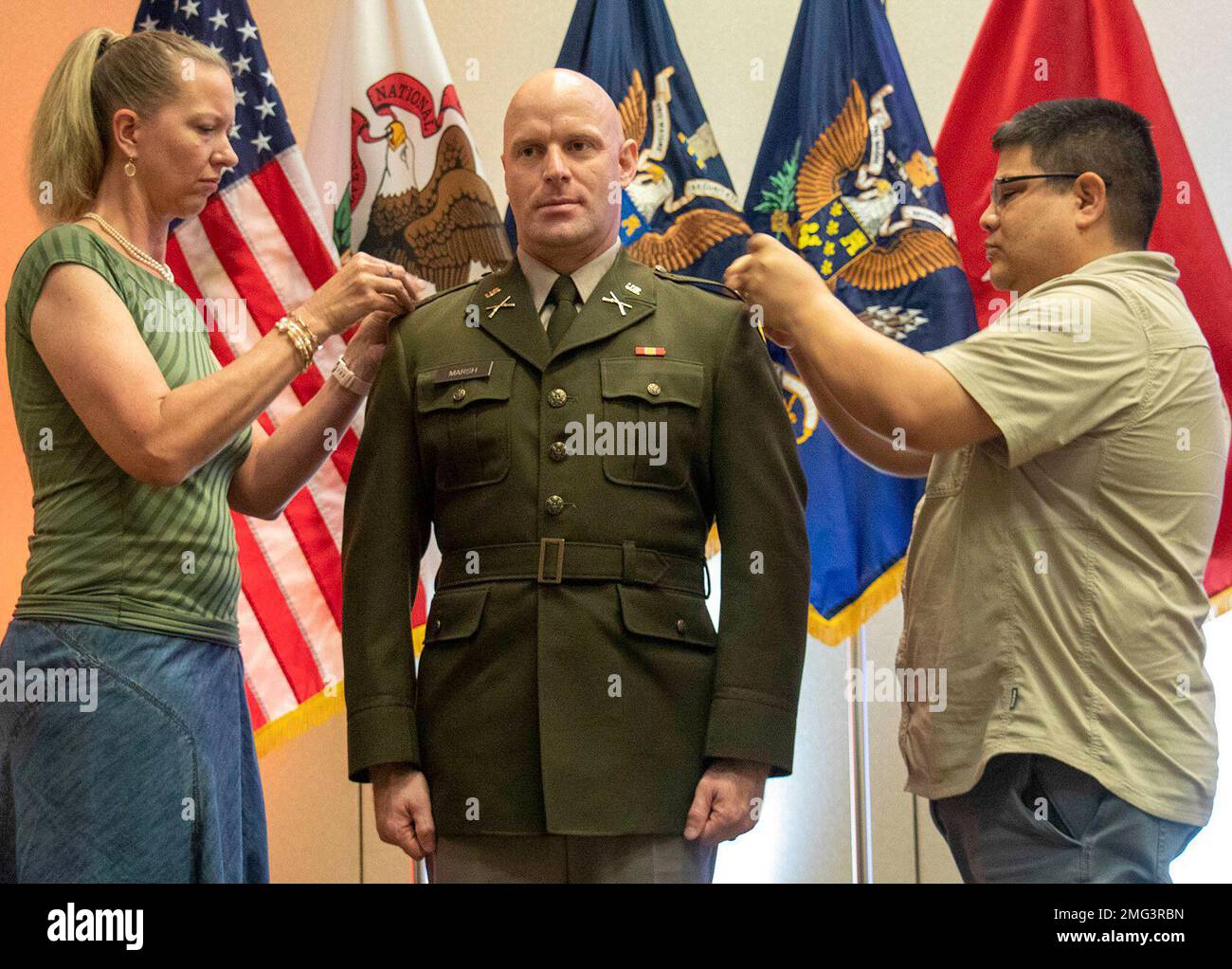 2nd Lt. Nicholas Marsh of Boise, Idaho, has his new rank pinned on by ...