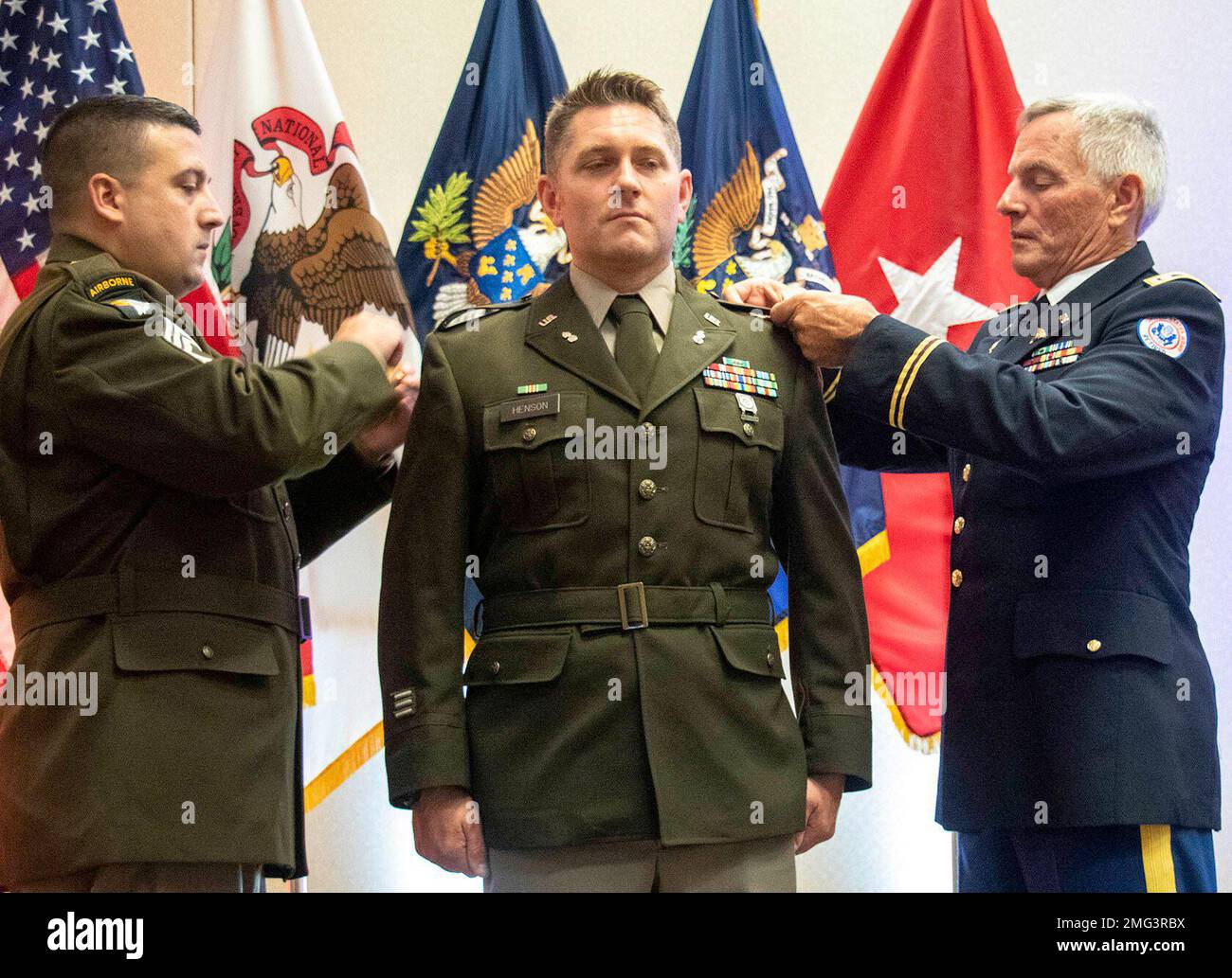 2nd Lt. Nicholas Henson of Byron, Illinois, has his new rank pinned on ...