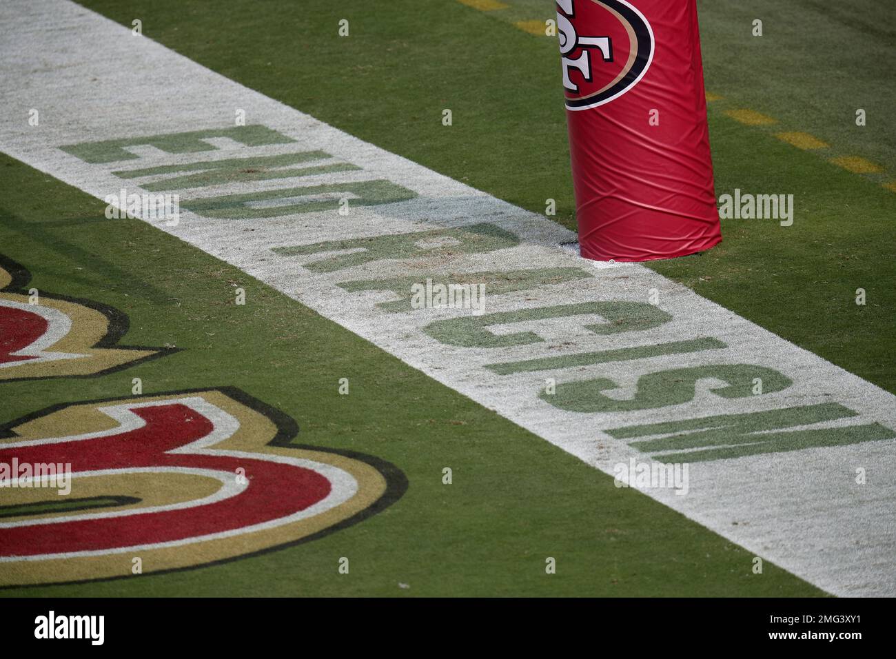 An "End Racism" sign is seen behind the south end zone as the San ...