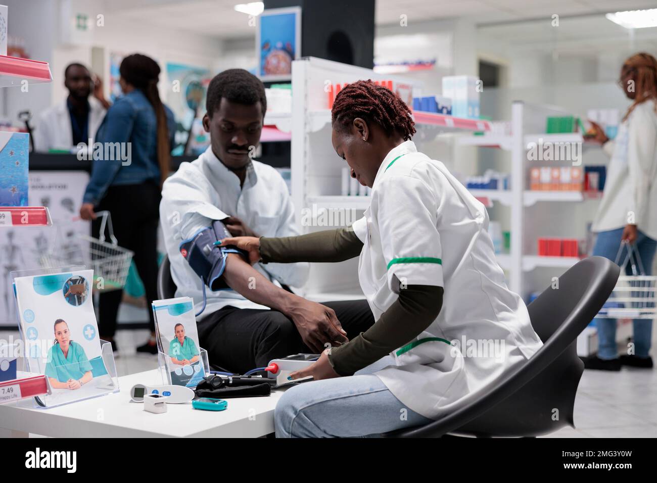 Pharmacist consultation, medic measuring patient blood pressure. Woman ...