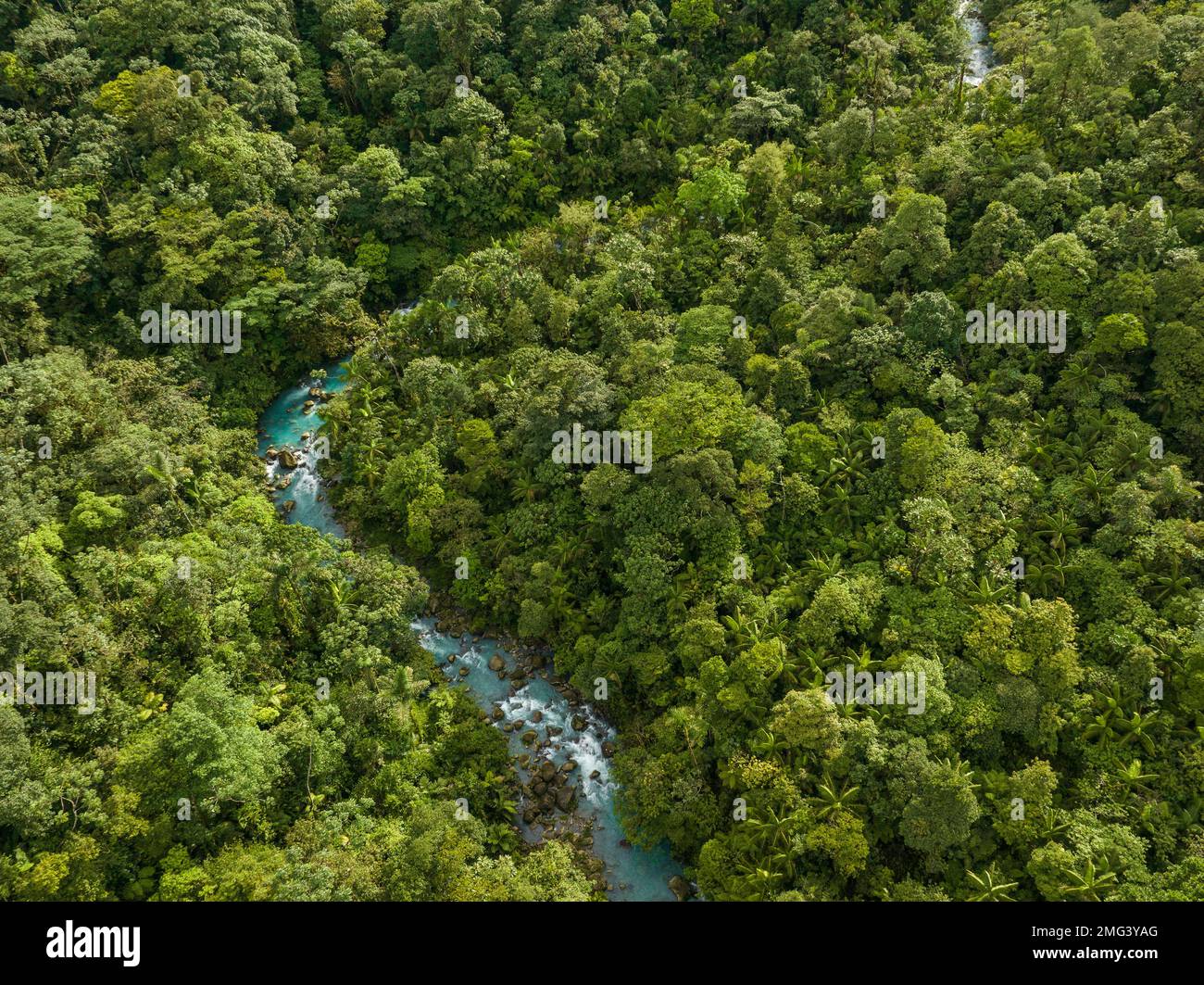 Aerial view of the Rio Celeste (sky blue river) at Tenorio Volcano ...