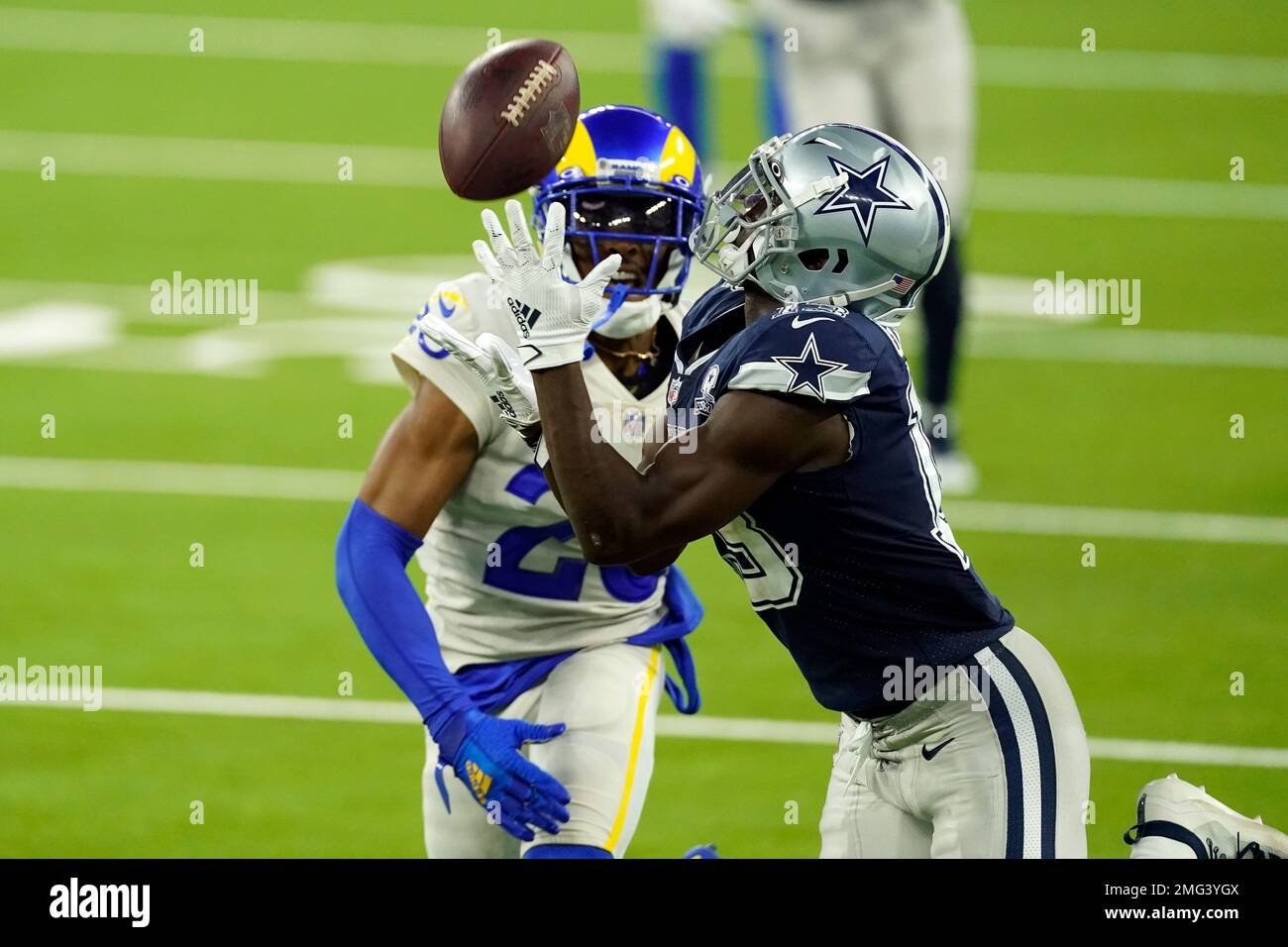 Dallas Cowboys wide receiver Michael Gallup, right, makes a catch but ...