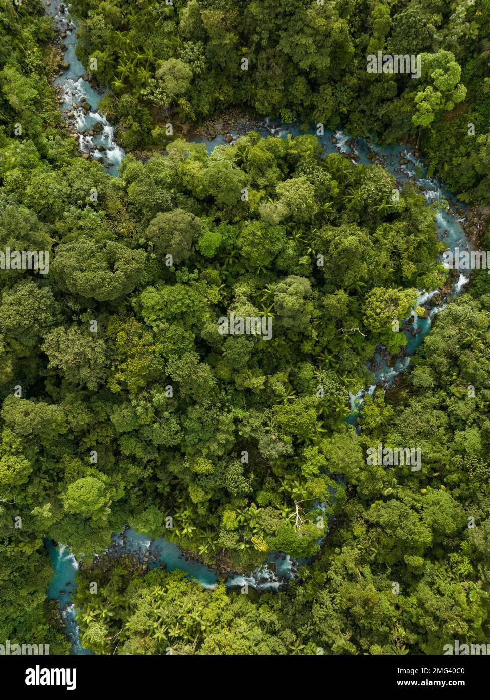 Aerial view of the Rio Celeste (sky blue river) at Tenorio Volcano ...