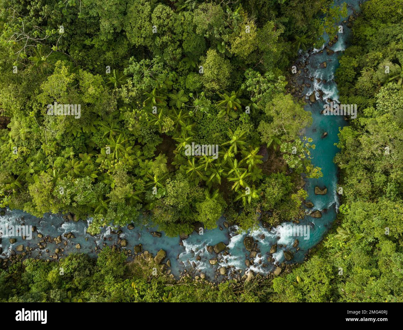 Aerial view of the Rio Celeste (sky blue river) at Tenorio Volcano ...
