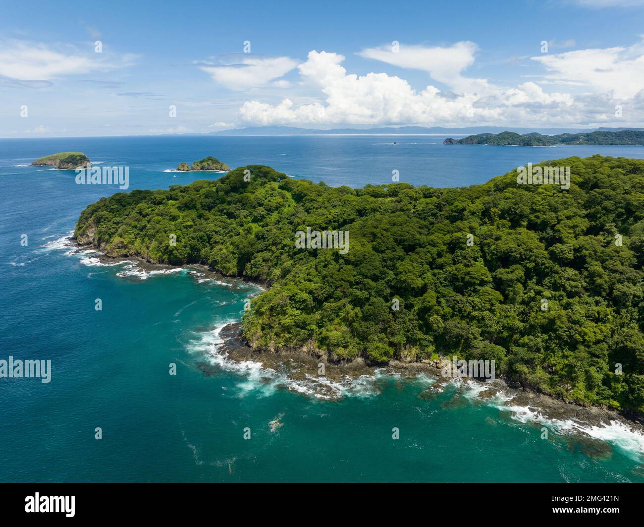 Aerial view of the vibrant green coast along the Gulf of Papagayo ...