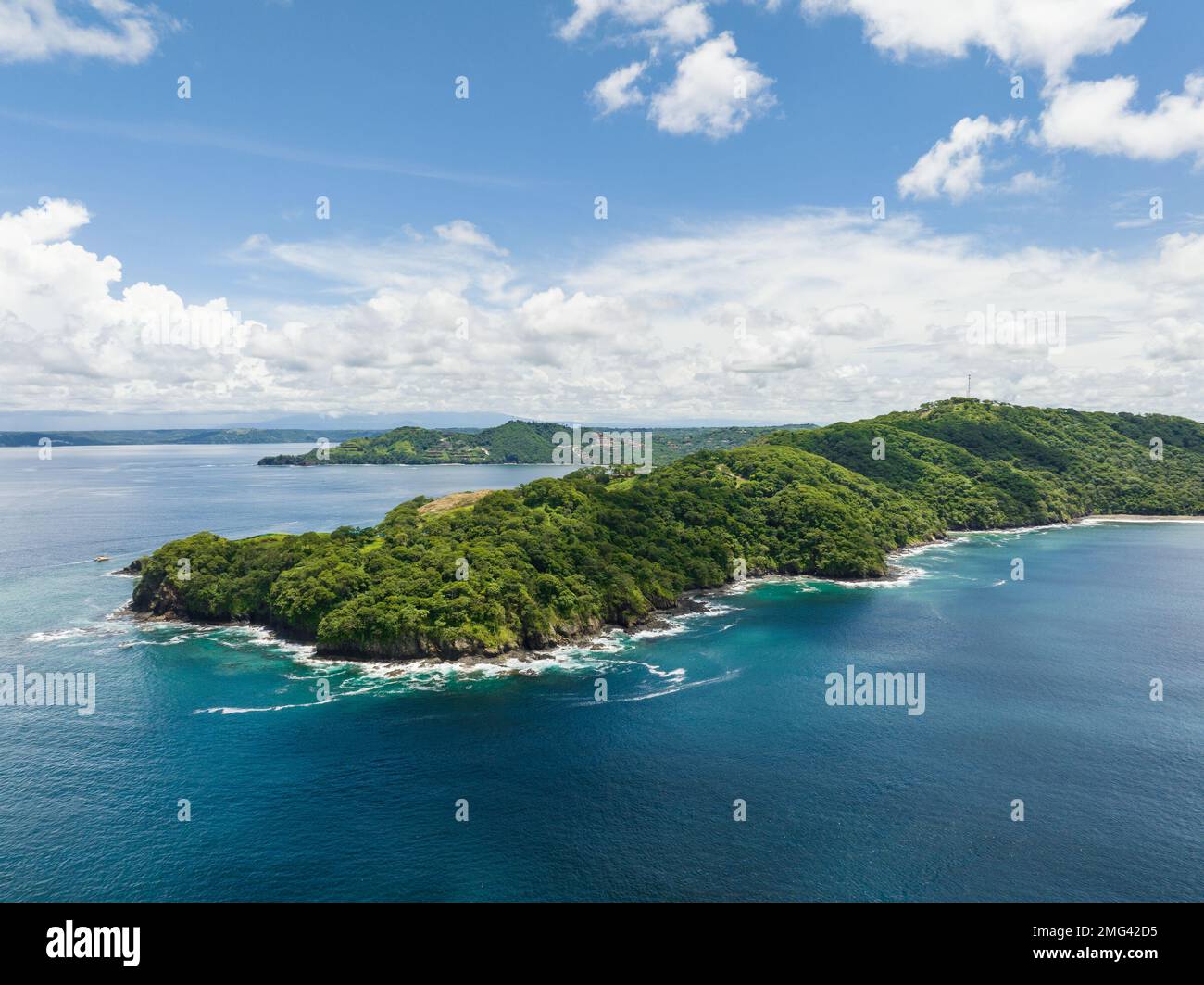 Aerial view of the vibrant green coast along the Gulf of Papagayo ...