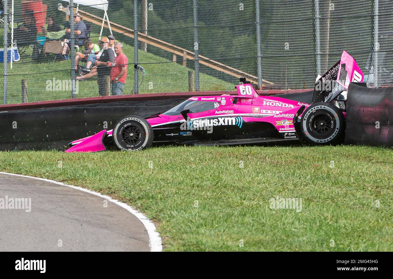 Jack Harvey of England (60) hits the fence during qualifying for the ...