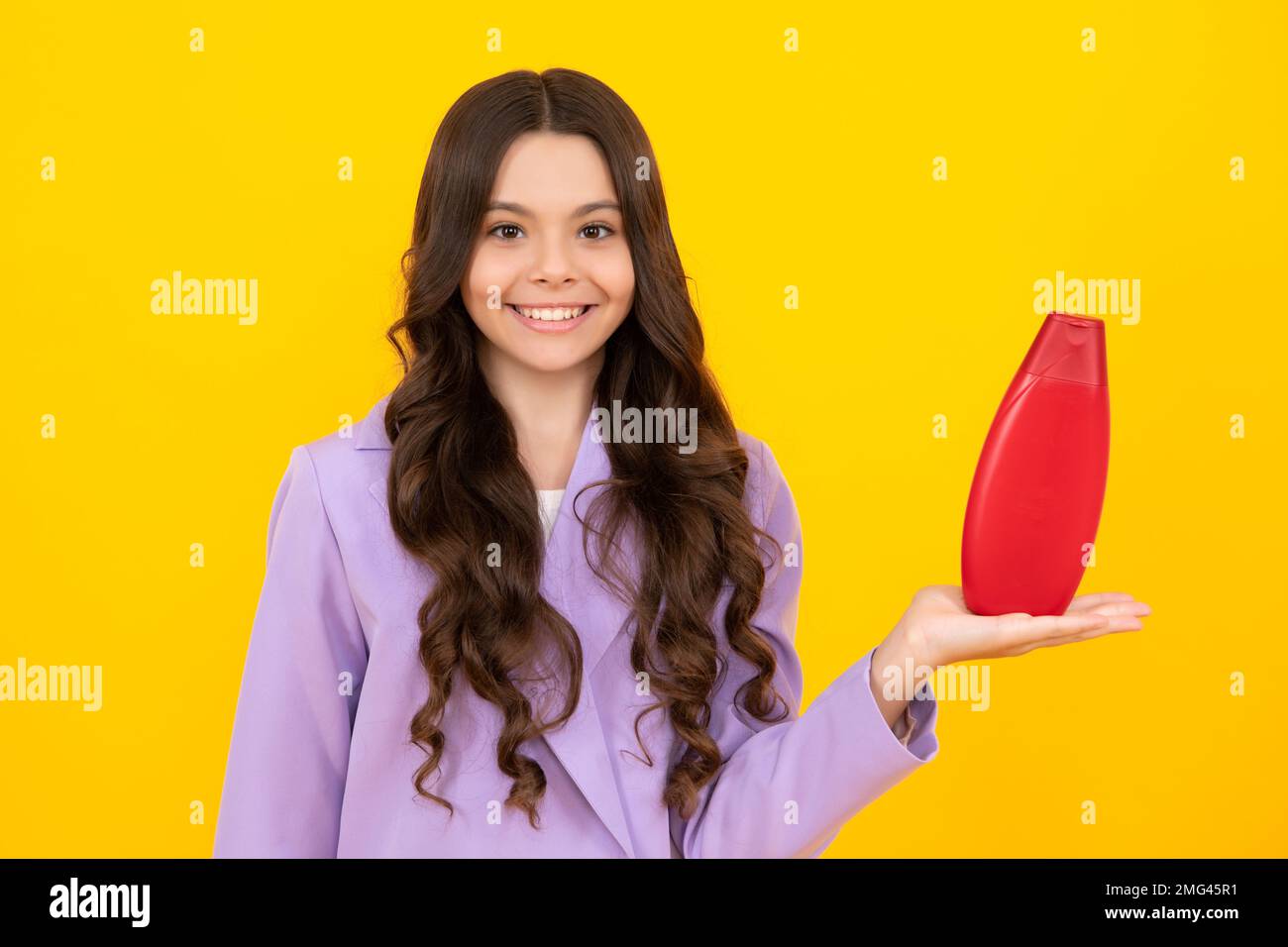 Teenage girl with shampoos conditioners or shower gel. Kids hair care ...