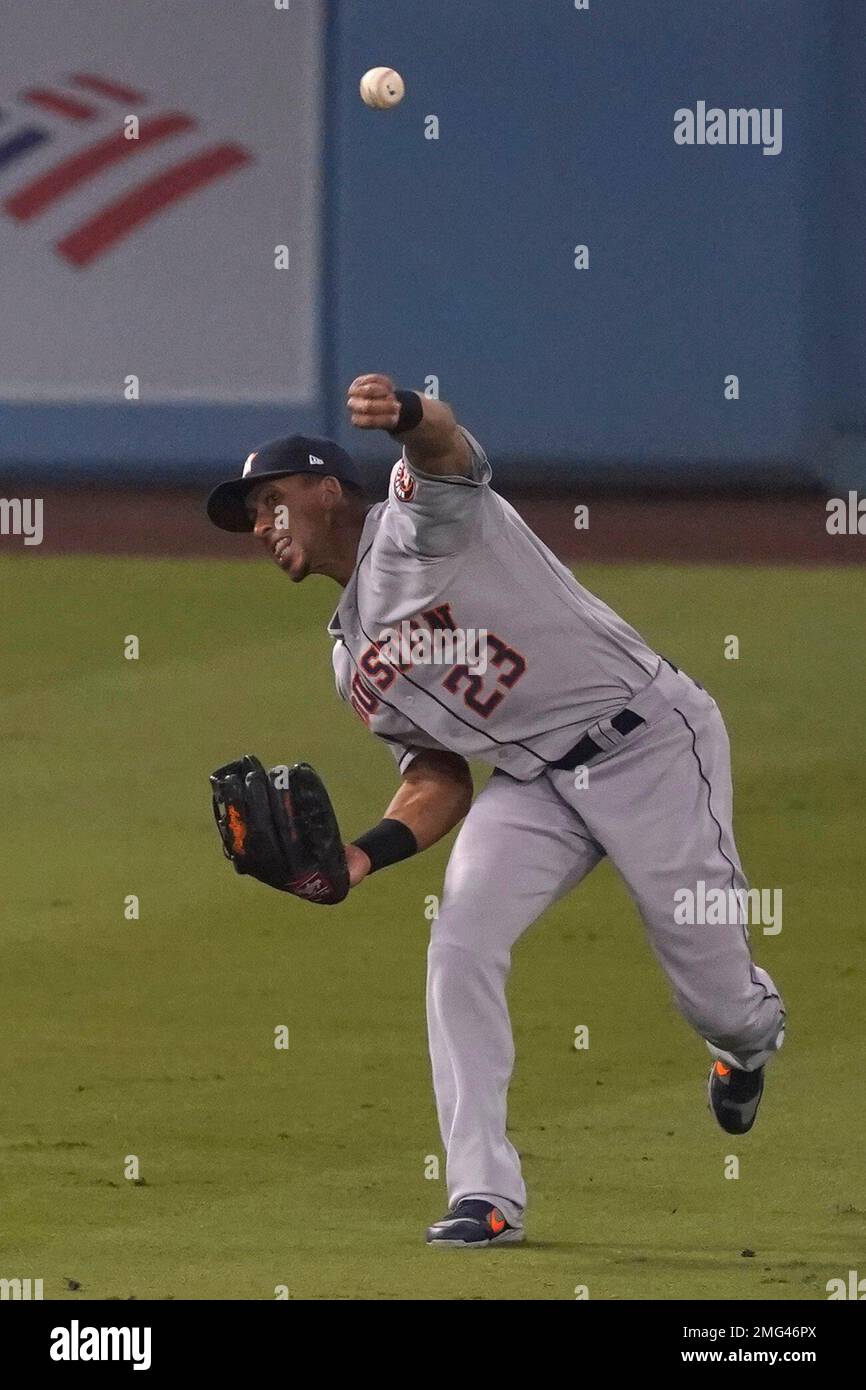 Houston Astros left fielder Michael Brantley throws after fielding a ...