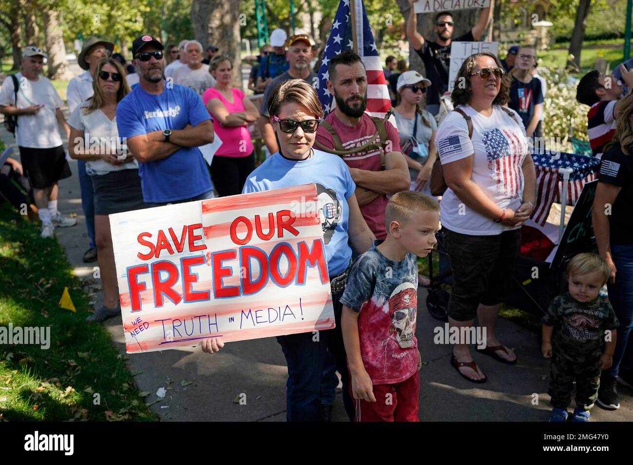 People protest Gov. Gary Herbert during an anti-mask rally outside of ...