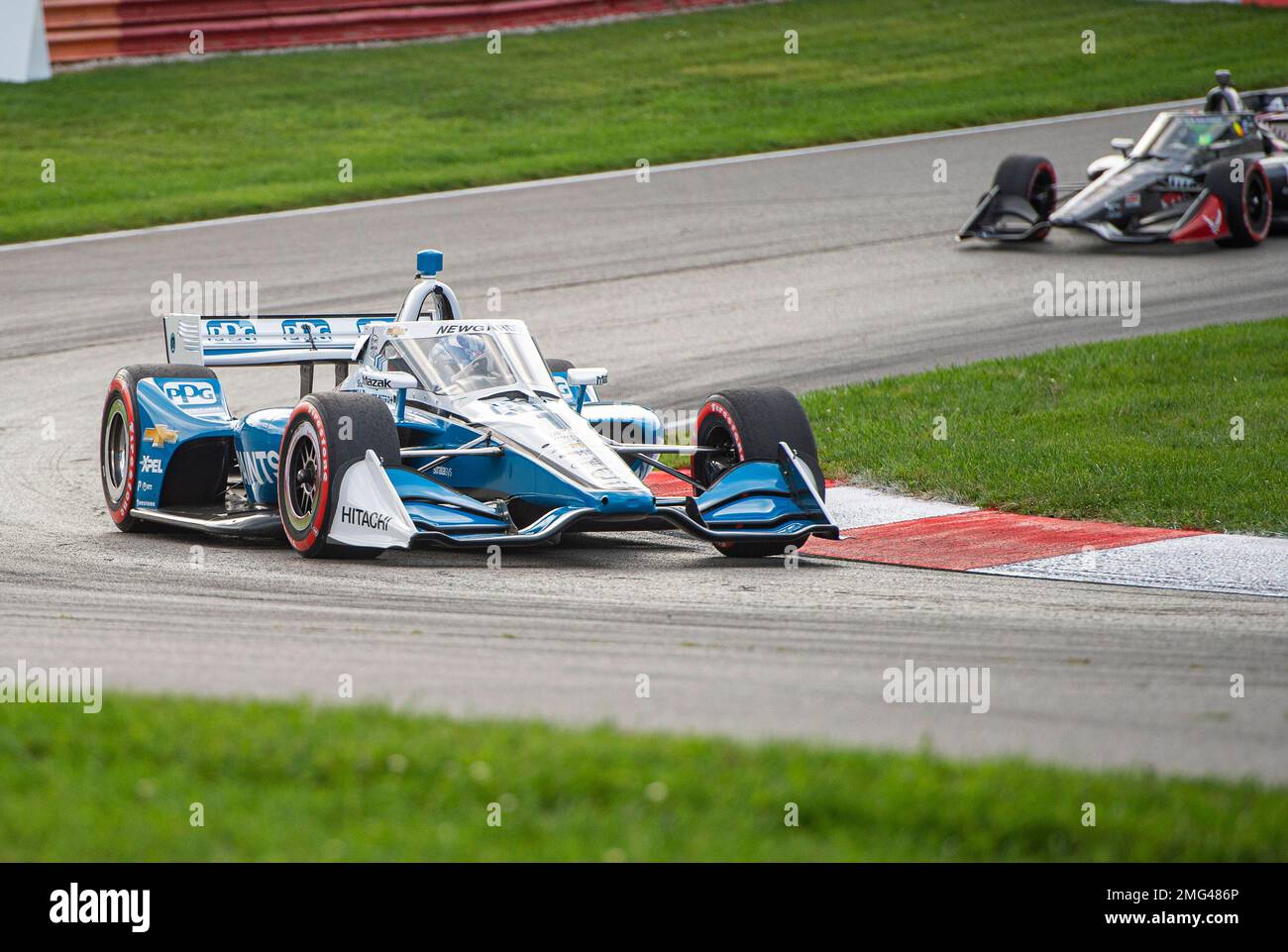 Josef Newgarden (1) exits a turn during the IndyCar Series auto race at ...