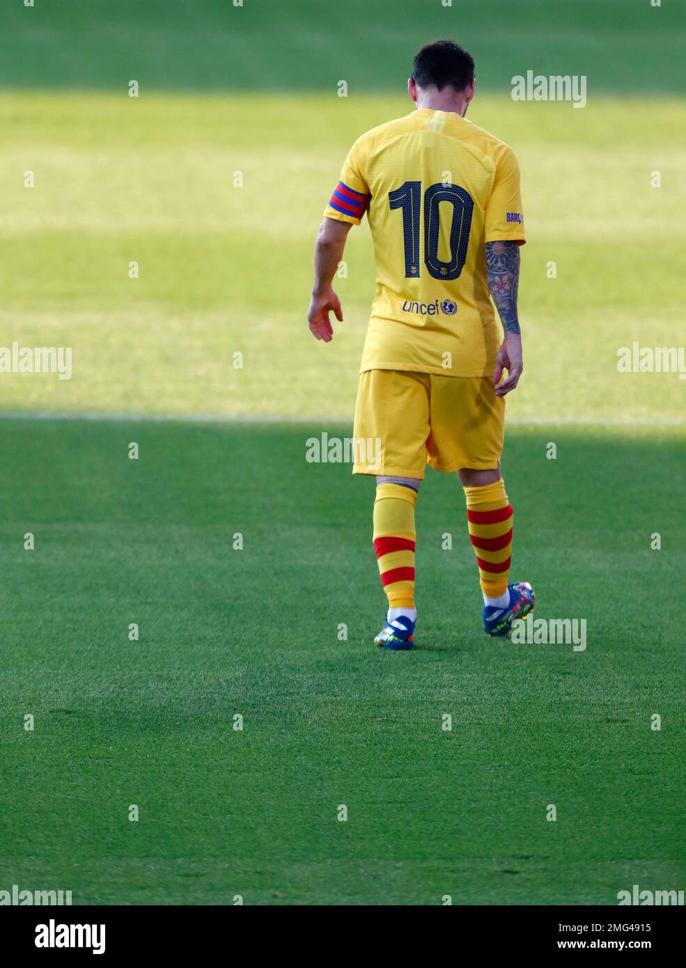 Barcelona's Lionel Messi walks on the pitch during the pre-season ...