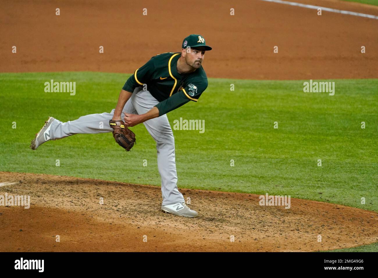 Oakland Athletics relief pitcher T.J. McFarland throws to the Texas ...