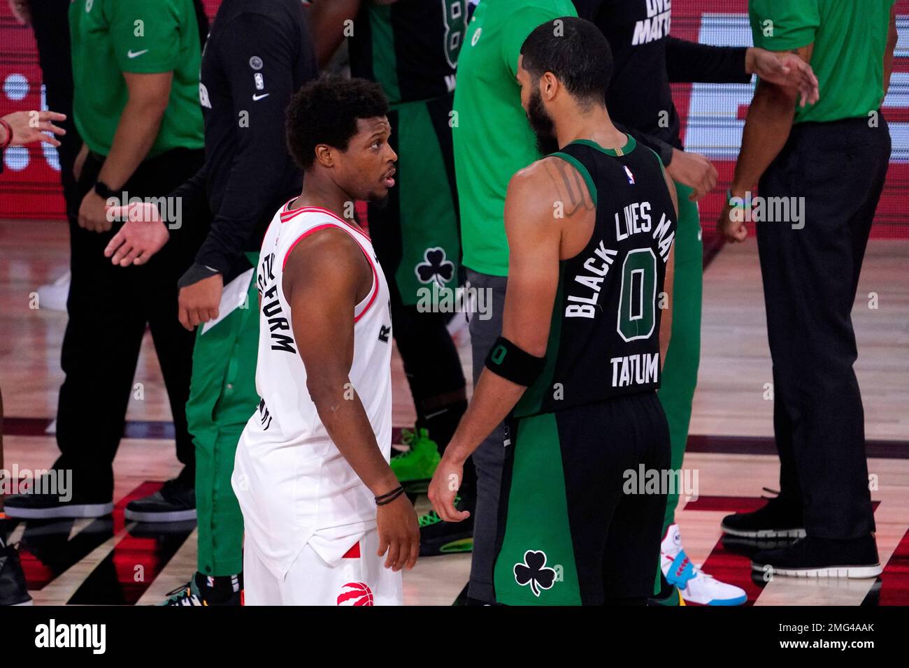 Toronto Raptors' Kyle Lowry, left, talks with Boston Celtics' Jayson ...