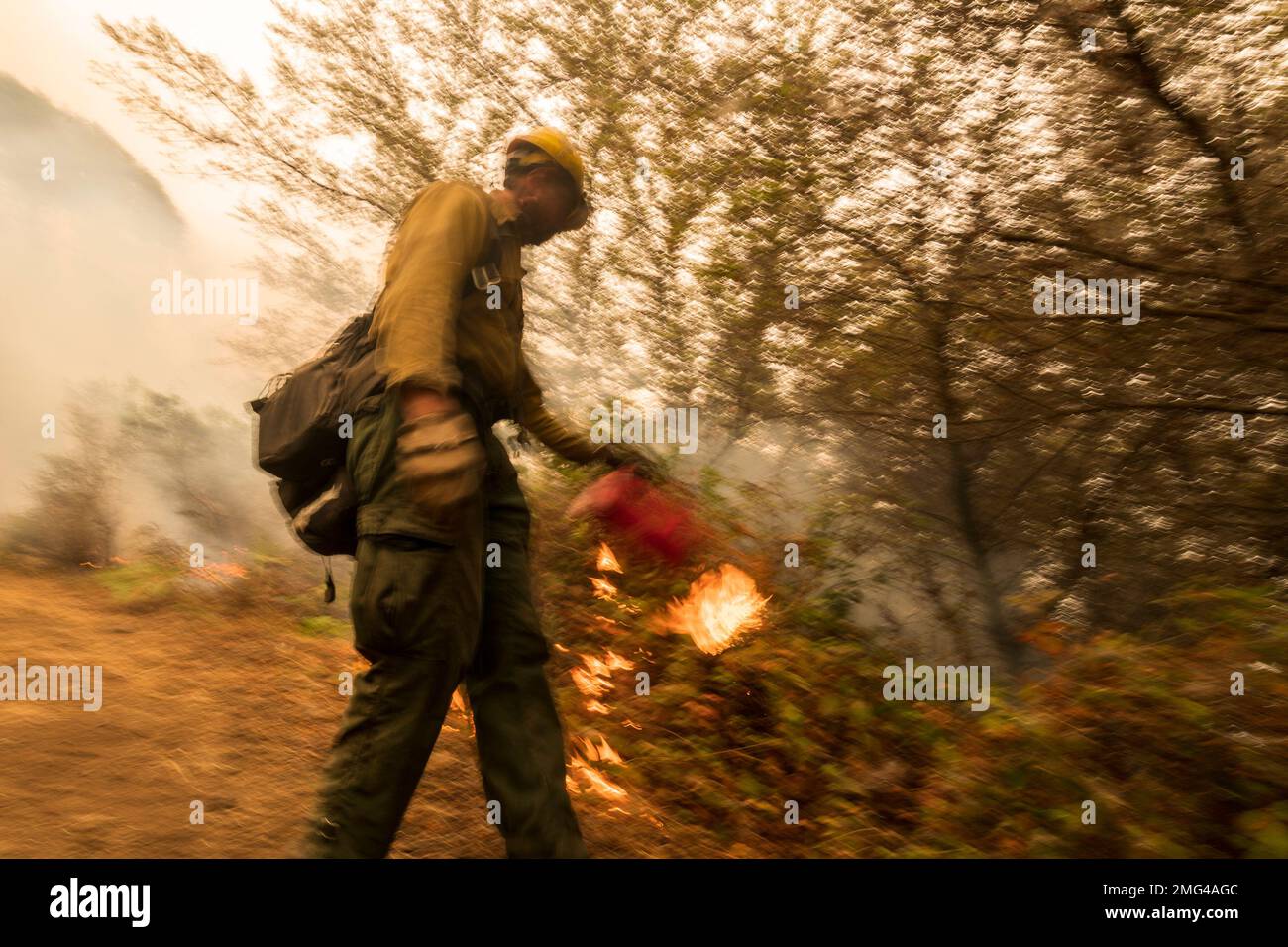 Firefighters from Vandenberg Air Force Base monitor a controlled burn ...