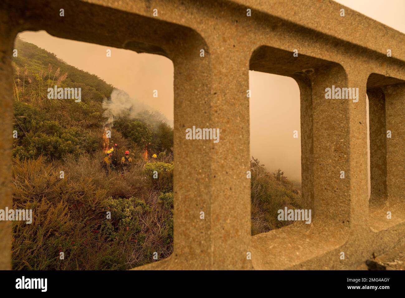 Firefighters with Vandenberg Air Force Base, light a back burn to help ...