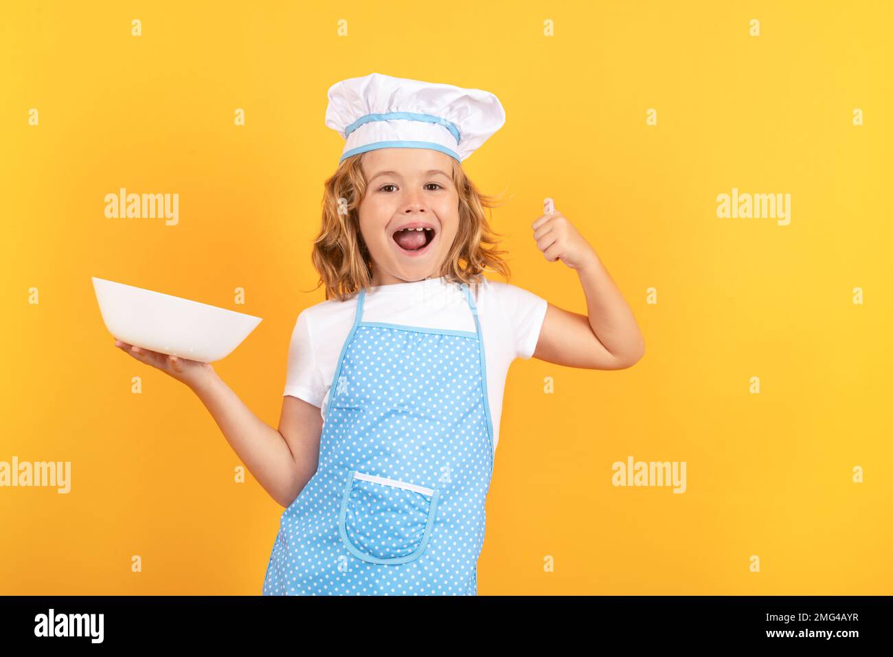 Funny kid chef cook with kitchen plate, studio portrait. Cooking ...