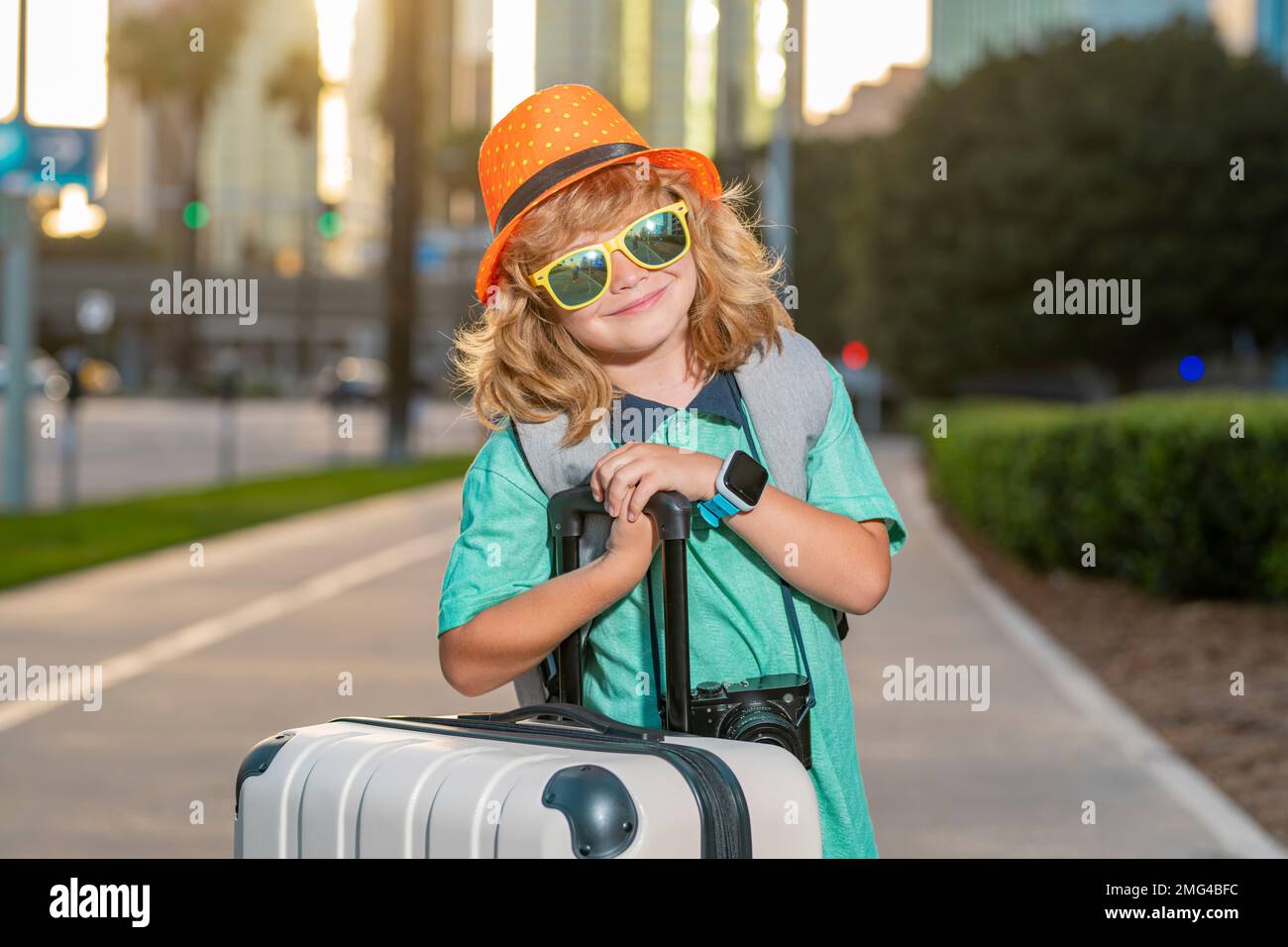 Kid traveller with suitcase going on vacation. Tourist boy on holiday ...