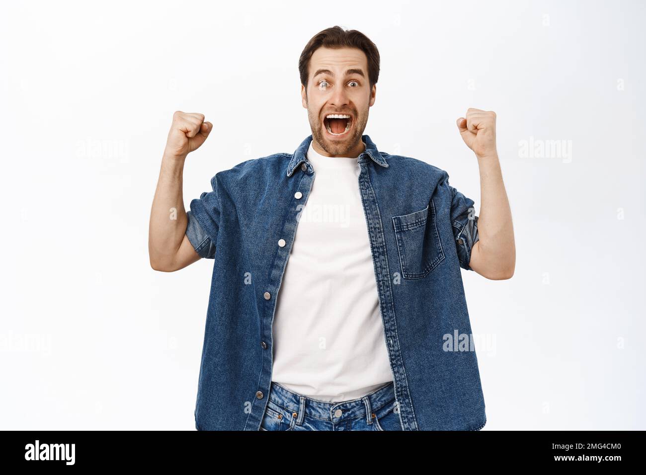 Image of enthusiastic adult man winning and celebrating victory ...