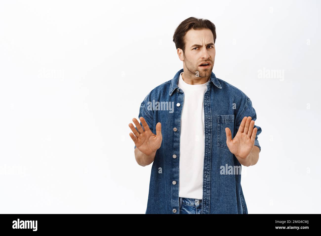 Portrait of man deny smth, shakes hands and say no, rejects offer ...