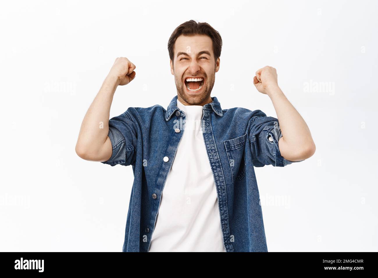 Image of enthusiastic adult man winning and celebrating victory ...