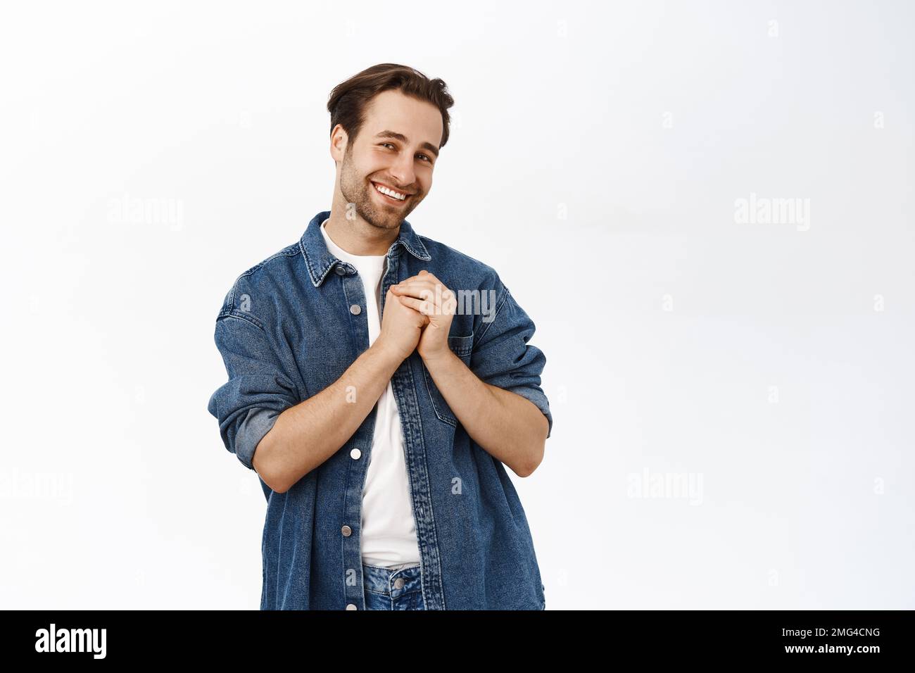 Portrait of handsome smiling guy looking thankful, express appreciation ...