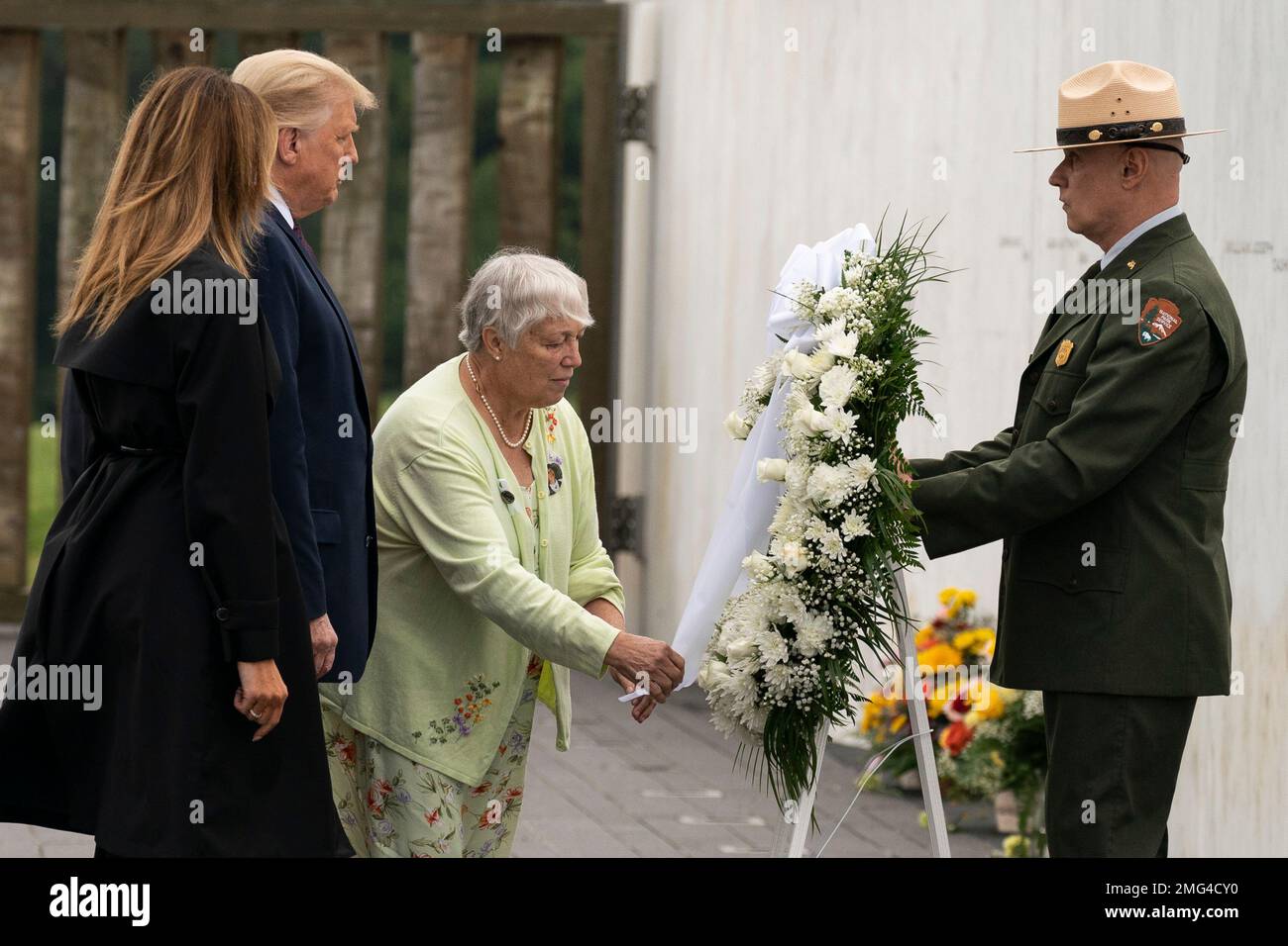 President Donald Trump and first lady Melania Trump watch as Nancy Root ...