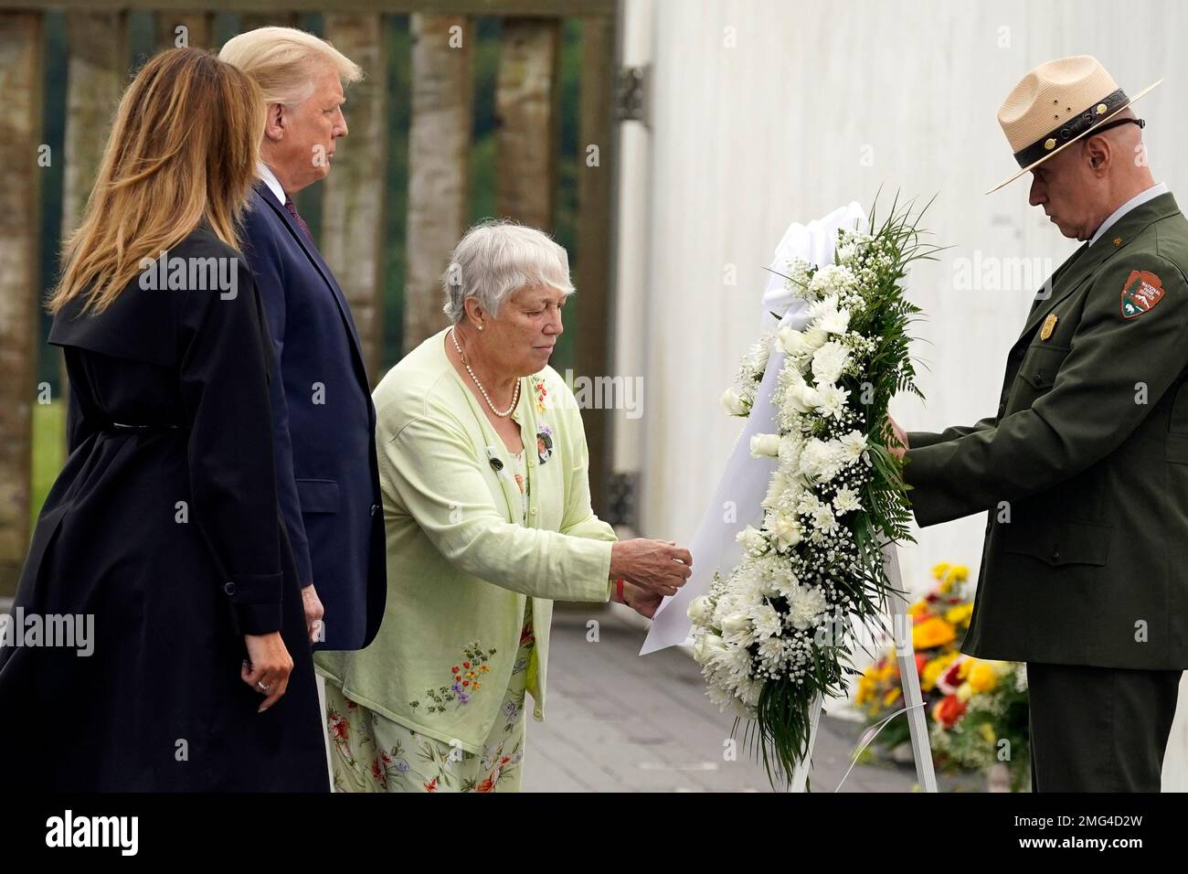President Donald Trump and first lady Melania Trump watch as Nancy Root ...