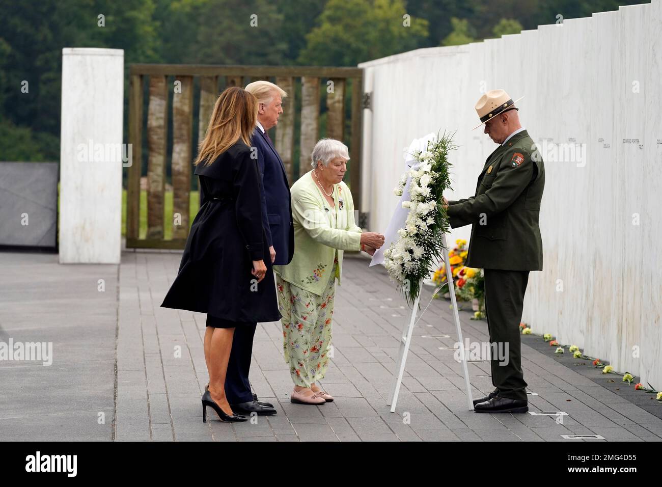 President Donald Trump and first lady Melania Trump watch as Nancy Root ...
