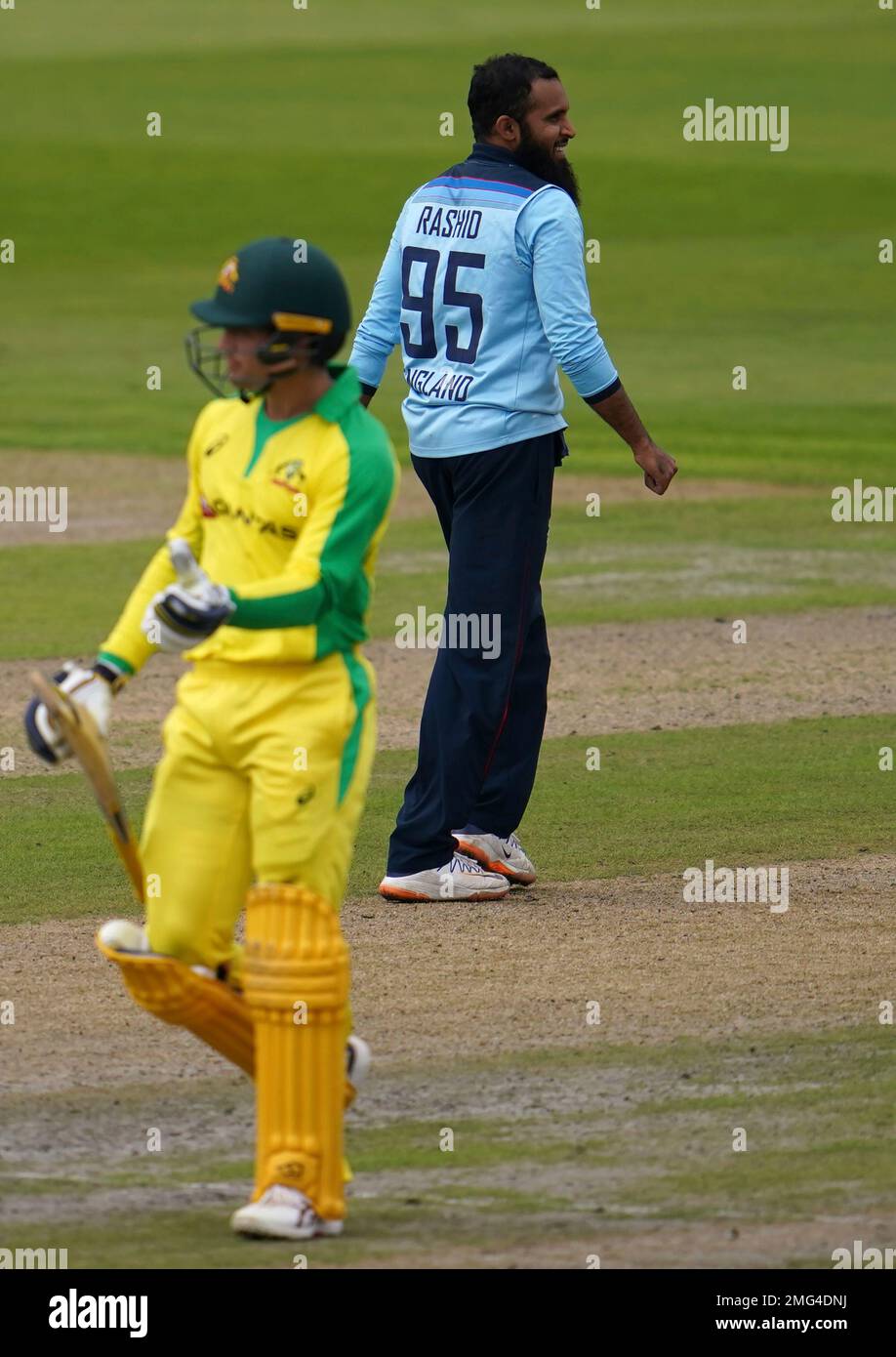 England's Adil Rashid, right, celebrates the dismissal of Australia's ...