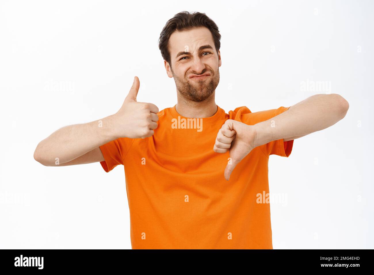 Like or dislike. Image of man shows thumbs up and thumbs down, negative ...